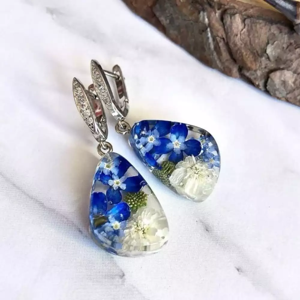 ARETES EN RESINA CON ACERO INOXIDABLE - La Plaza Morada